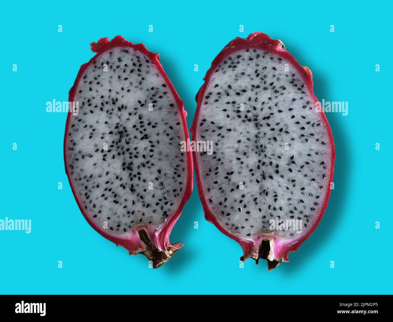 Dragon Fruit Cut Into Two Pieces Stock Photo - Alamy