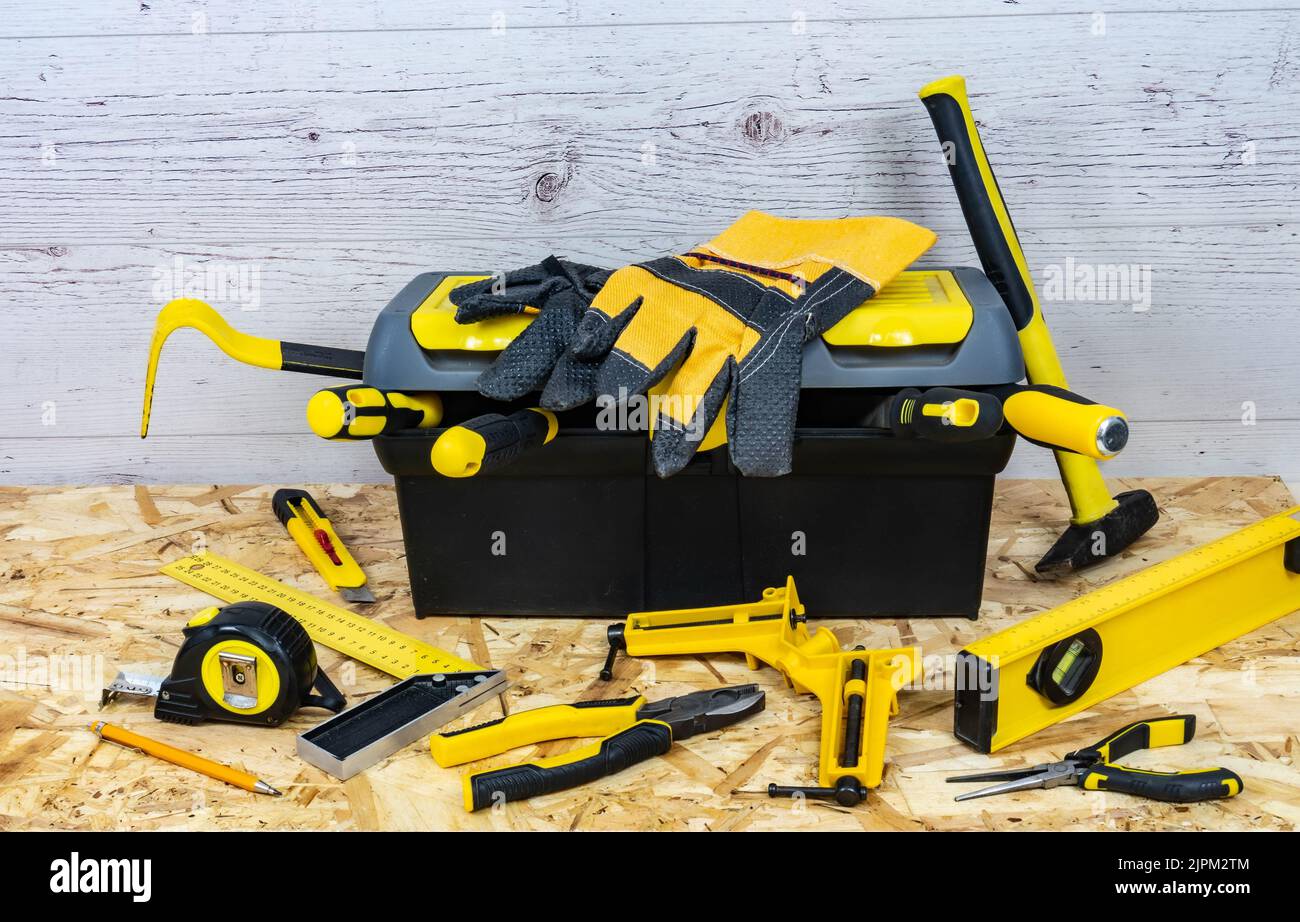 Construction instruments and a tool box on a wooden background. All ...