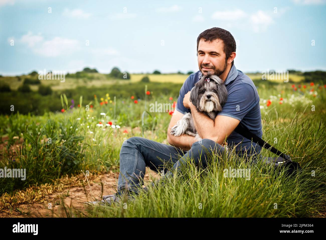 Tranquil and cheerful scene with a white Caucasian bearded man sitting ...