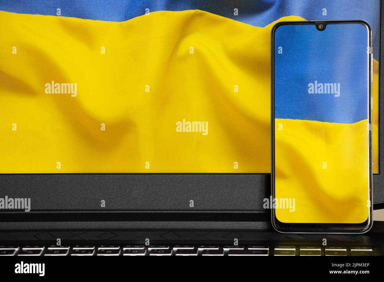 The national flag of Ukraine is yellow-blue as a background on the ...