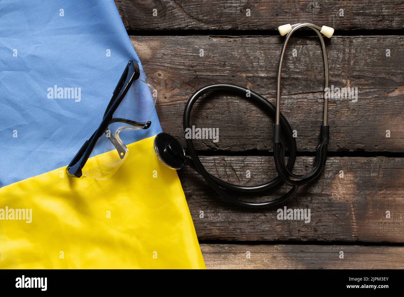 The stethoscope lies on the national flag of Ukraine yellow-blue ...