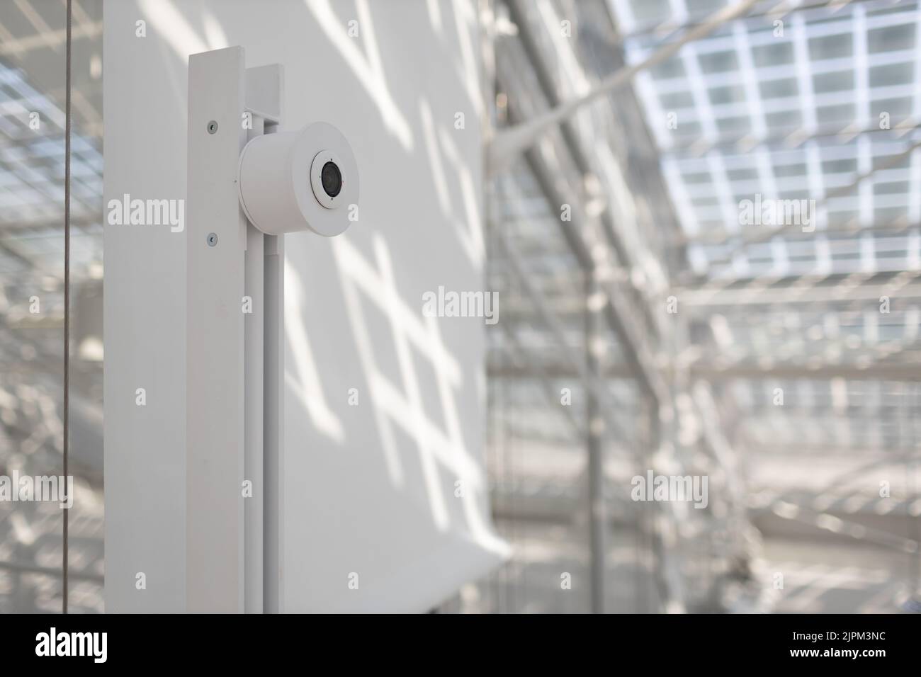 Face recognition system with camera in front of office in white ...