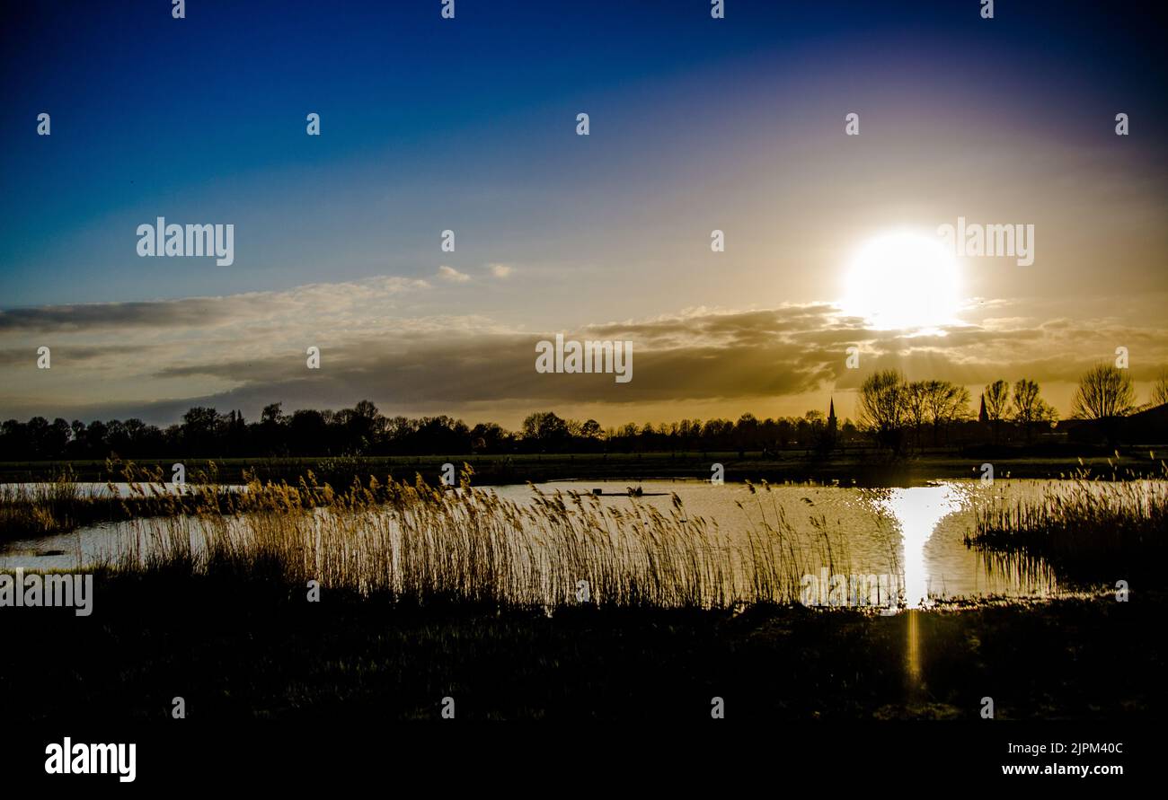 sunset landscape with water Stock Photo - Alamy