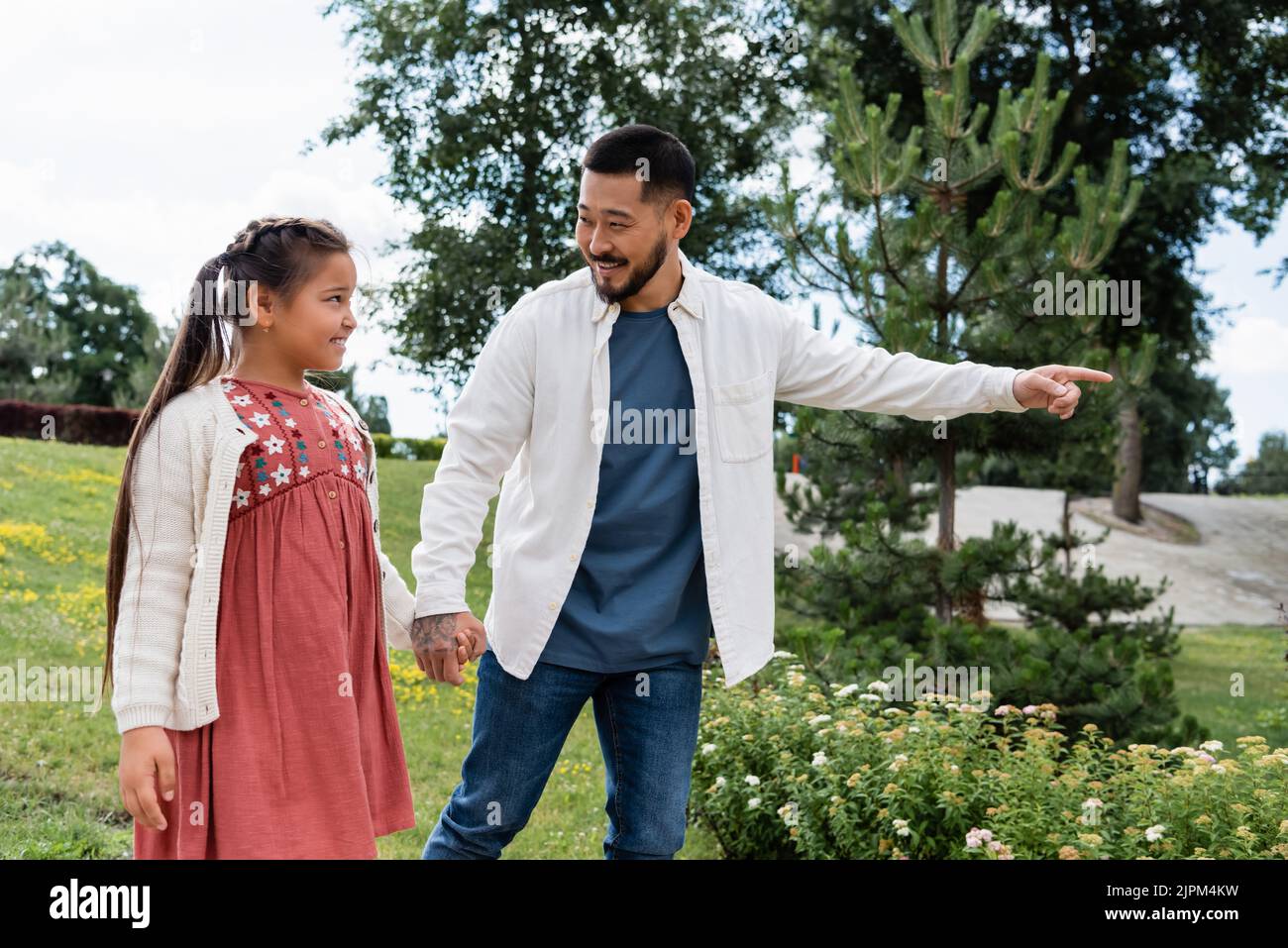 Child pointing at trees hi-res stock photography and images - Alamy