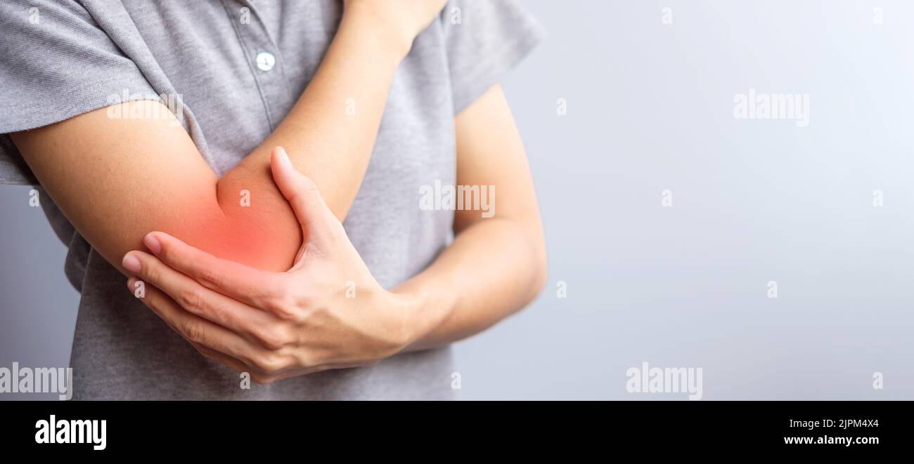adult female with her muscle pain on gray background. Woman having ...