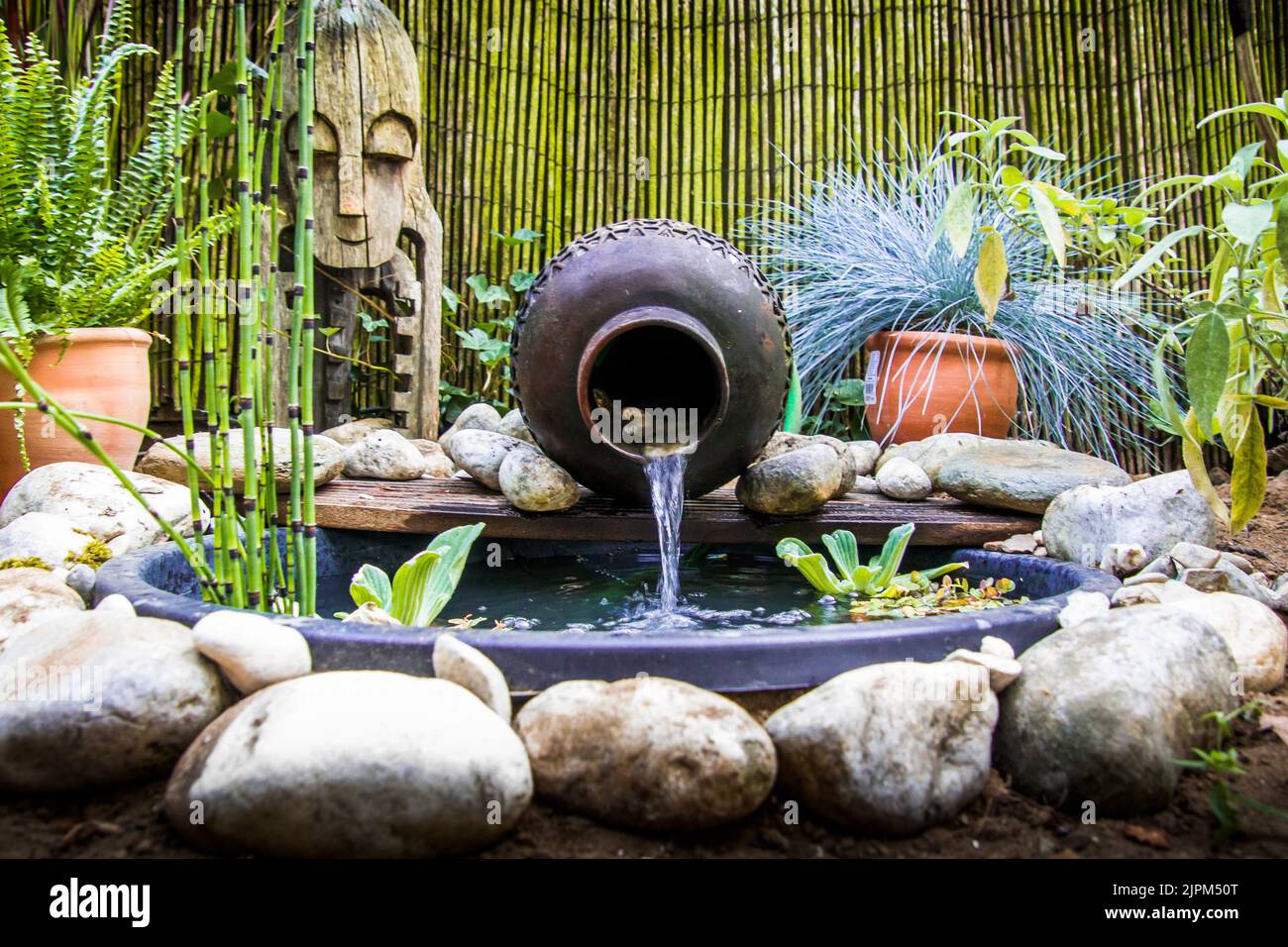 mini pond with water feature Stock Photo - Alamy
