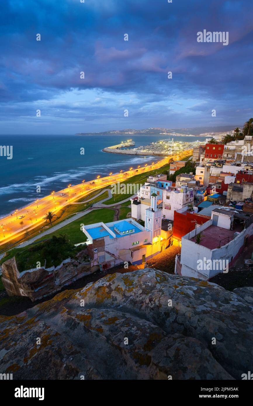 An aerial view of cityscape Tangier surrounded by buildings and water ...