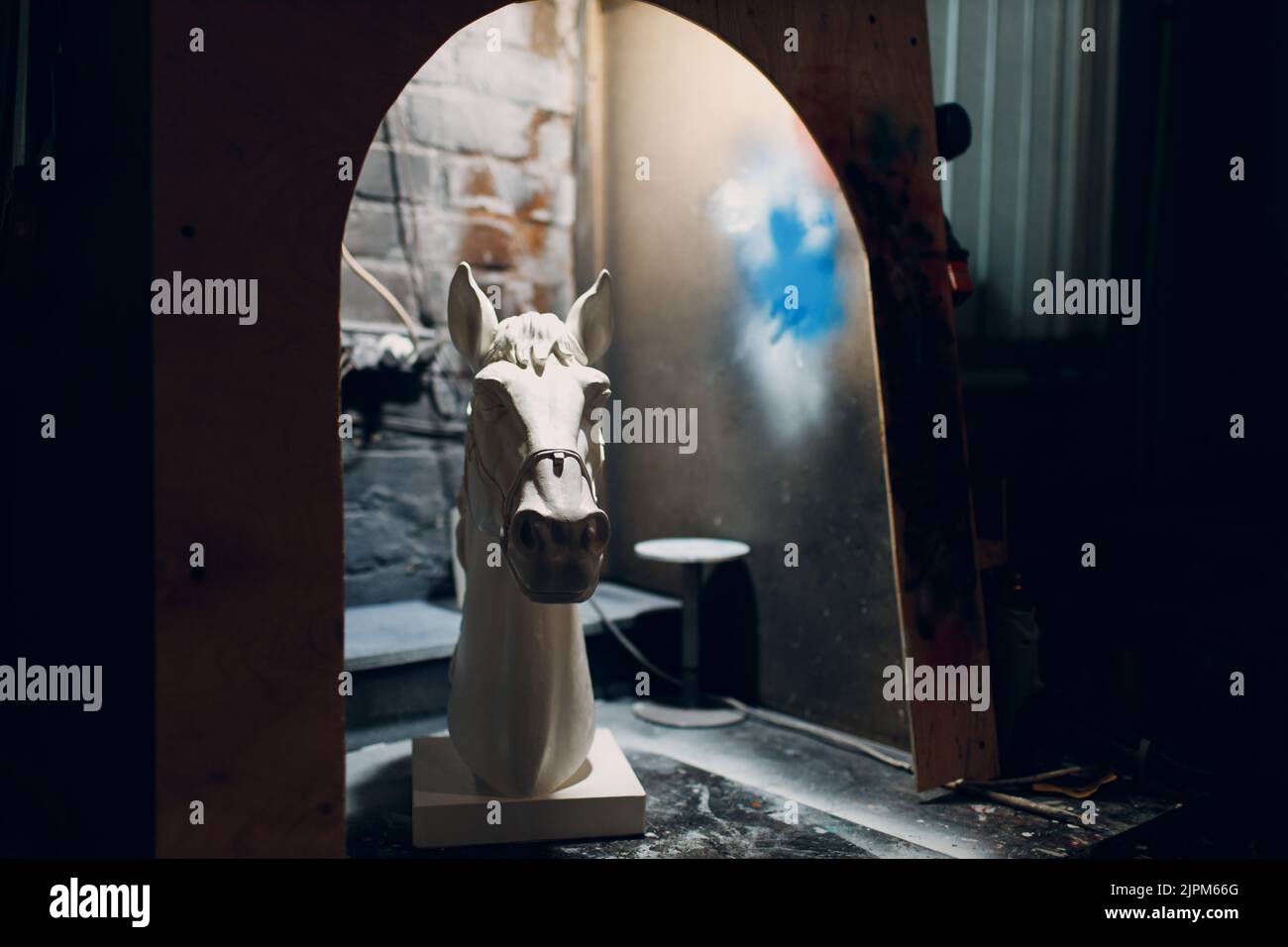 Artisan craftsman create horse based on plaster cast. Gypsum mold and ...