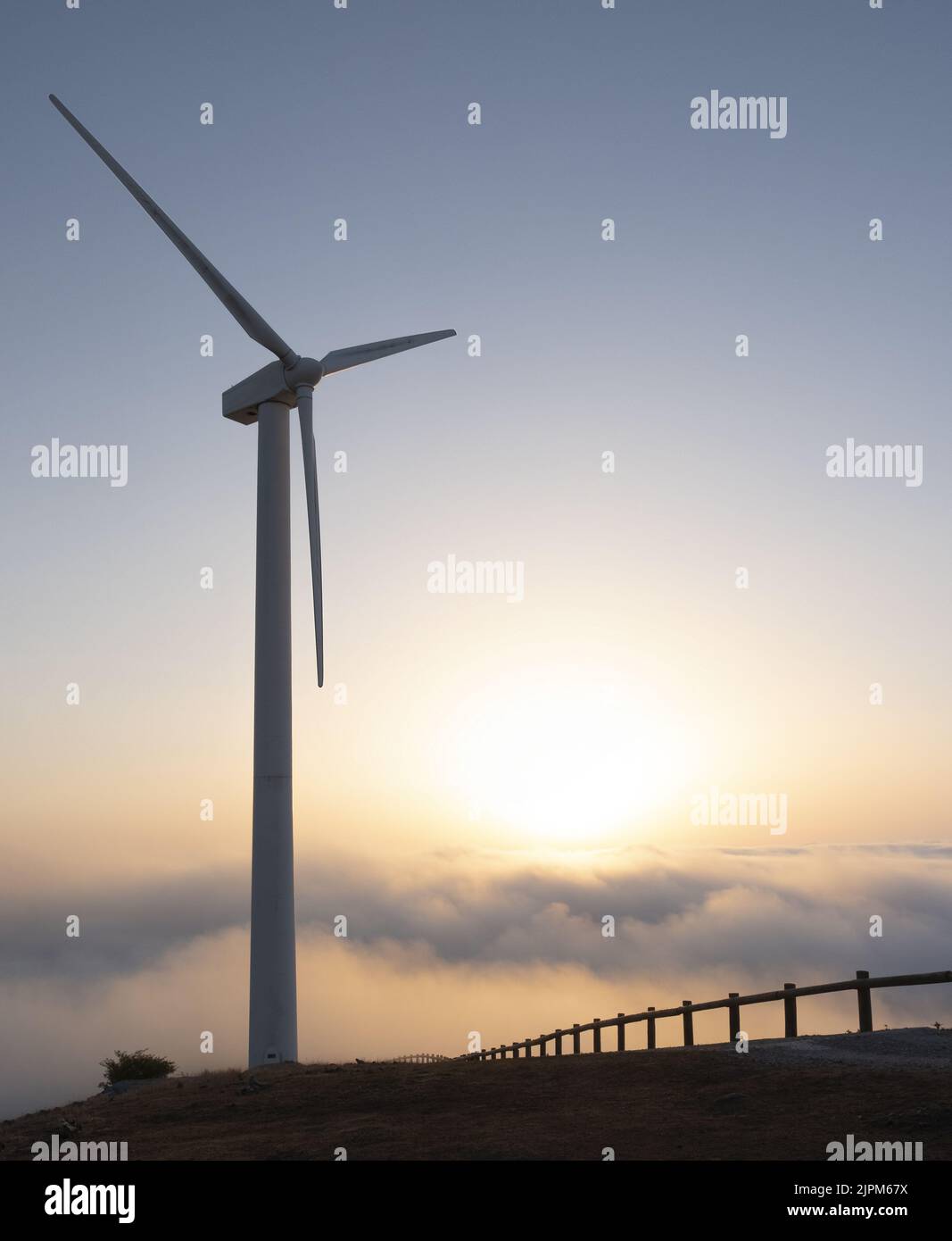 Wind turbines sunset above clouds hi-res stock photography and images ...