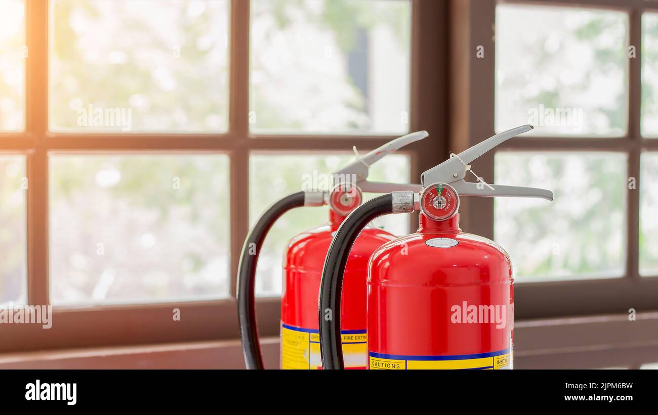 The red fire extinguisher is ready for use in case of an indoor fire ...