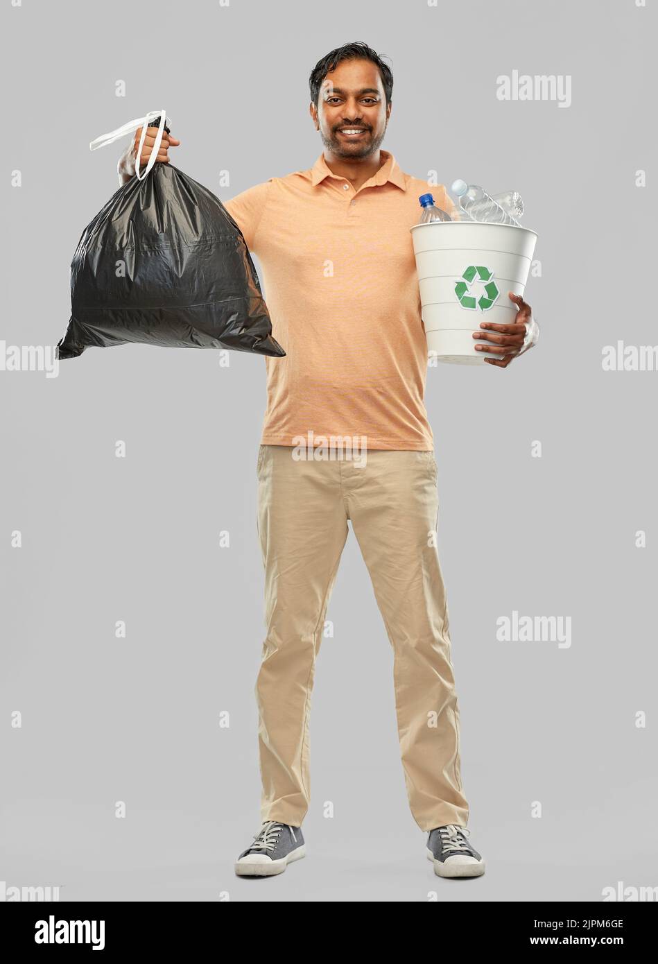 smiling indian man sorting paper and plastic waste Stock Photo - Alamy