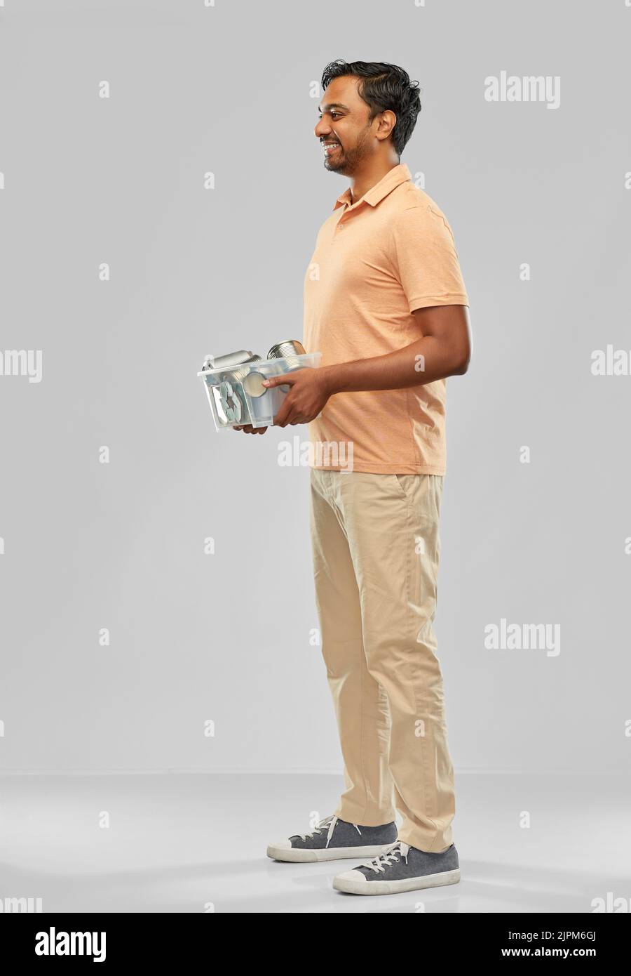 smiling young indian man sorting metallic waste Stock Photo - Alamy