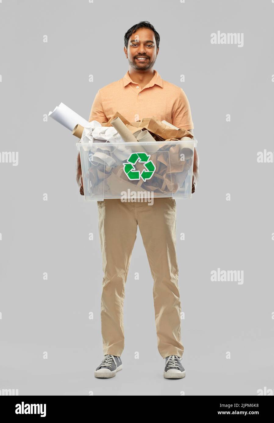 smiling young indian man sorting paper waste Stock Photo - Alamy