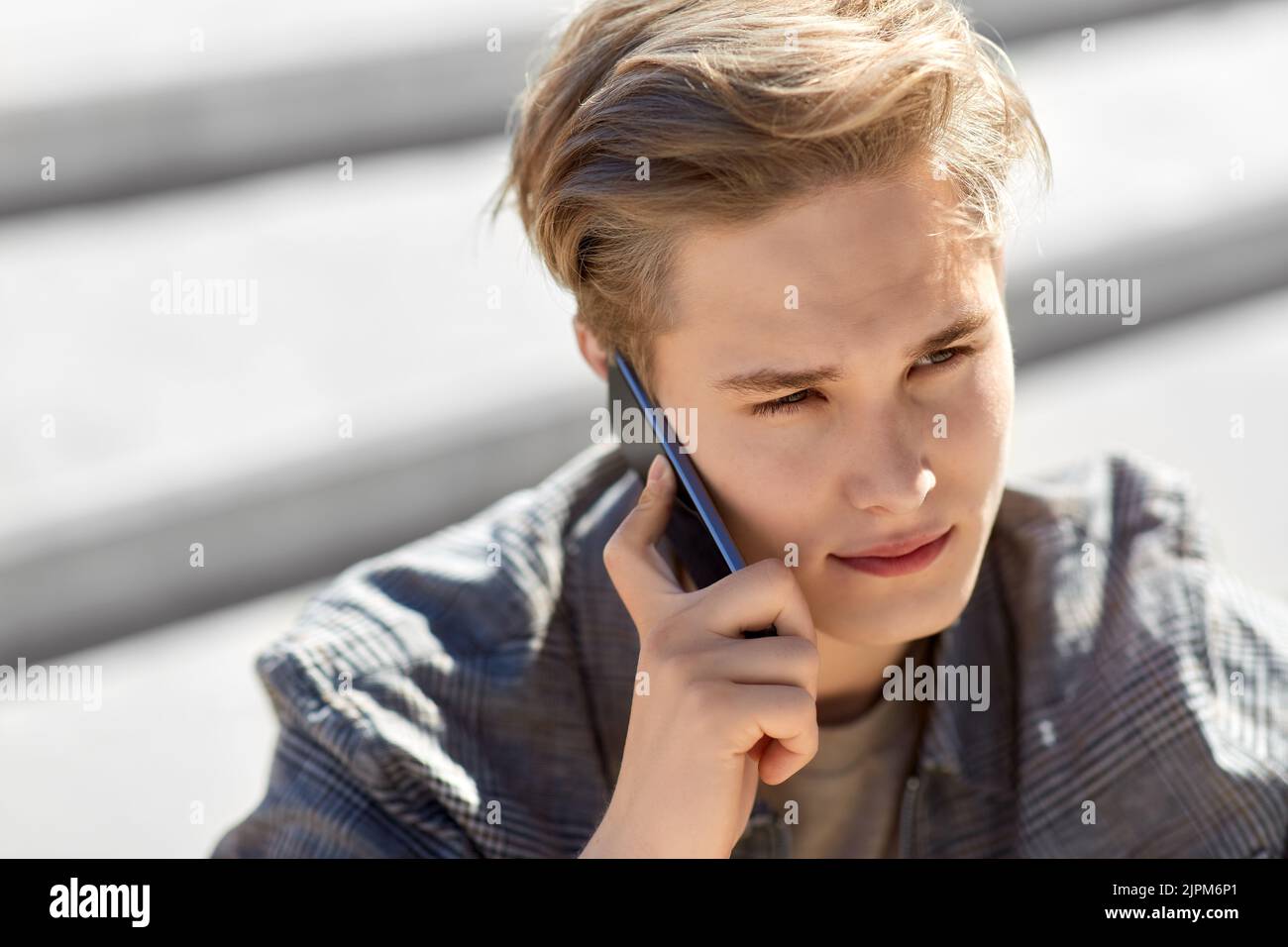 teenage boy calling on smartphone outdoors Stock Photo - Alamy
