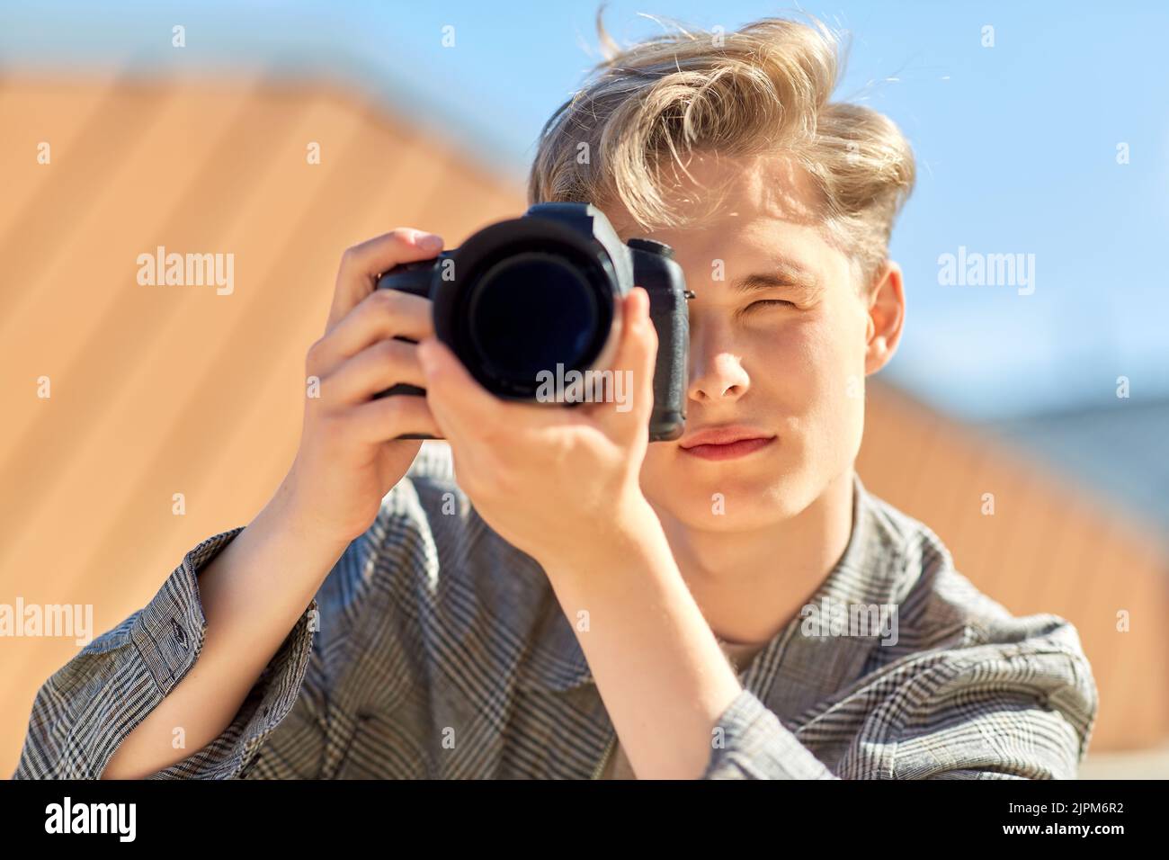 Adult photographing boy hi-res stock photography and images - Alamy