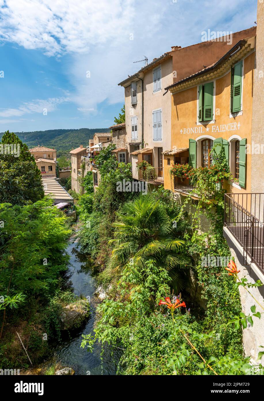 Spring flows going thru the iconic Moustiers-Sainte-Marie or Moustiers ...