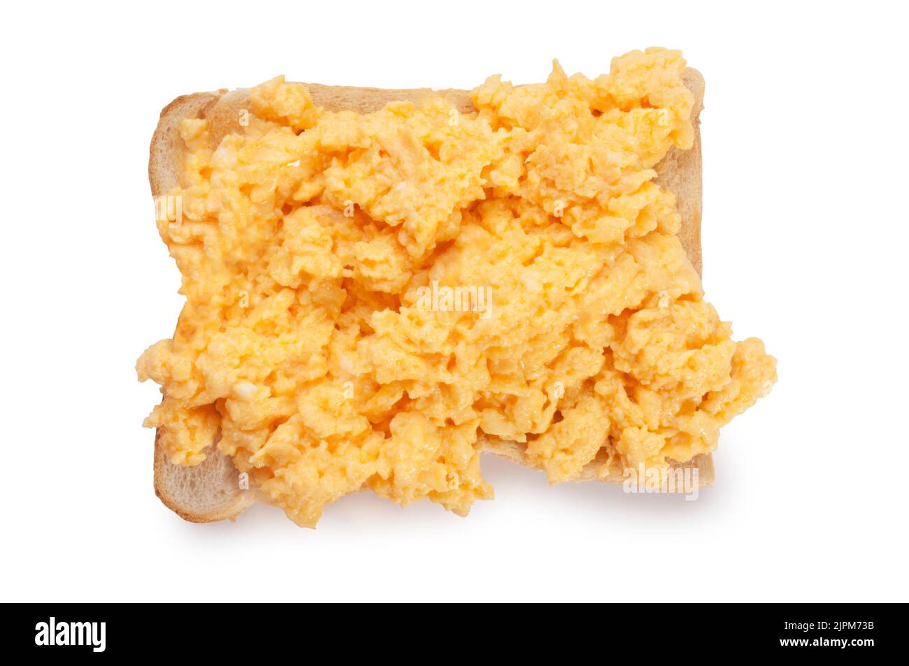 Studio shot of scrambled eggs on toast cut out against a white ...