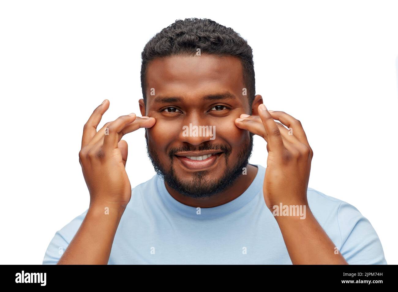 happy african american man touching his face Stock Photo - Alamy