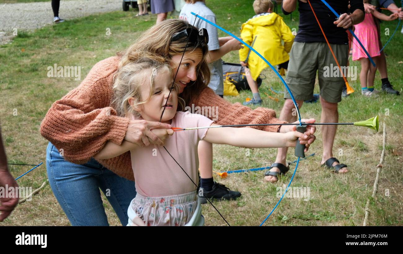 Mum teaching daughter the basics of archery - John Gollop Stock Photo ...