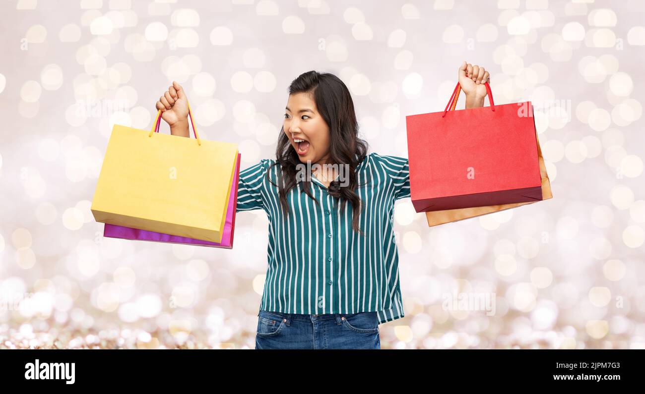 happy asian woman with shopping bags Stock Photo - Alamy
