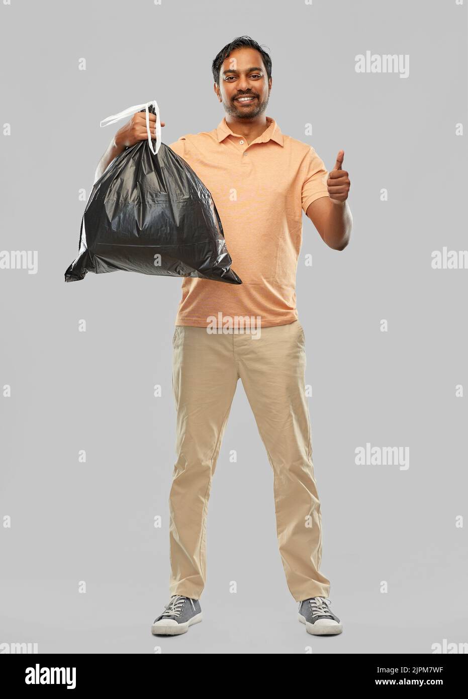 happy indian man with trash bag showing thumbs up Stock Photo - Alamy