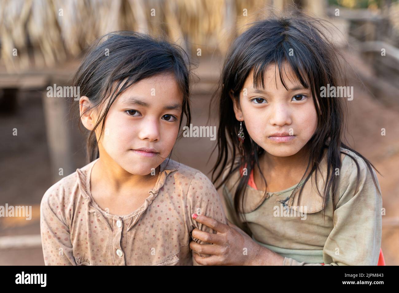 The two Asian girls' portrait in Luang Namtha ethnic village in Laos ...