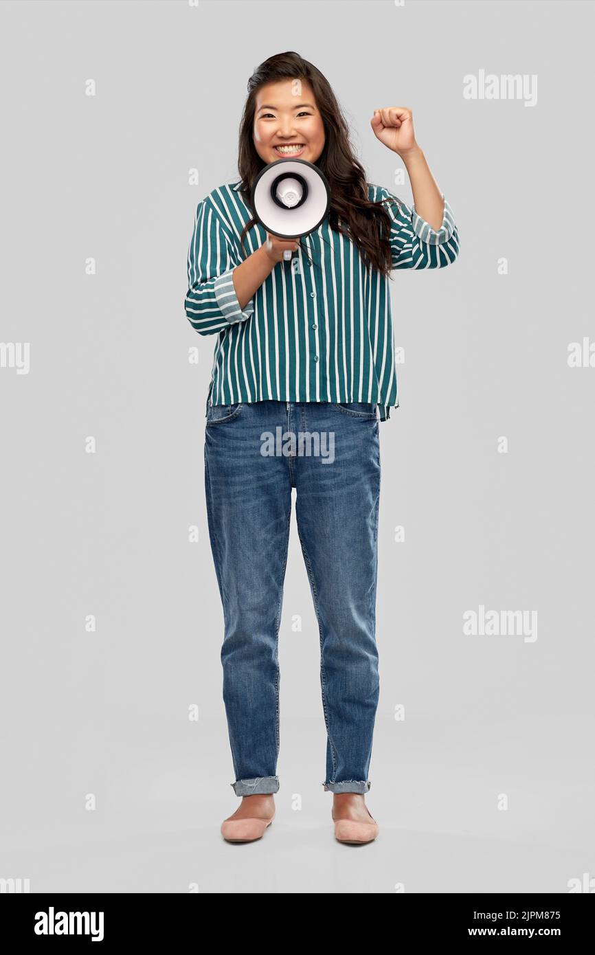 happy smiling asian woman speaking to megaphone Stock Photo - Alamy