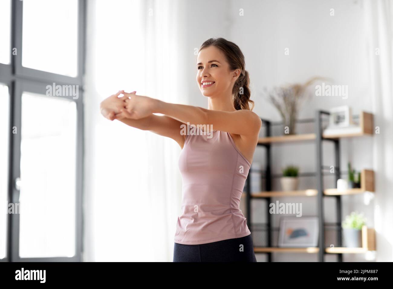 Woman training arms home workout hi-res stock photography and images ...