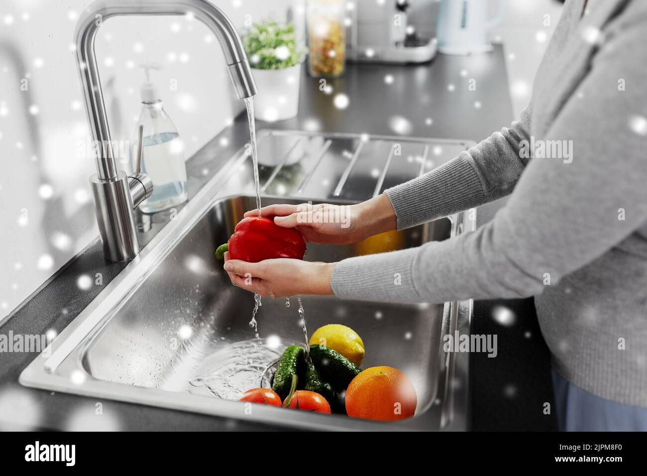 woman washing fruits and vegetables in kitchen Stock Photo - Alamy