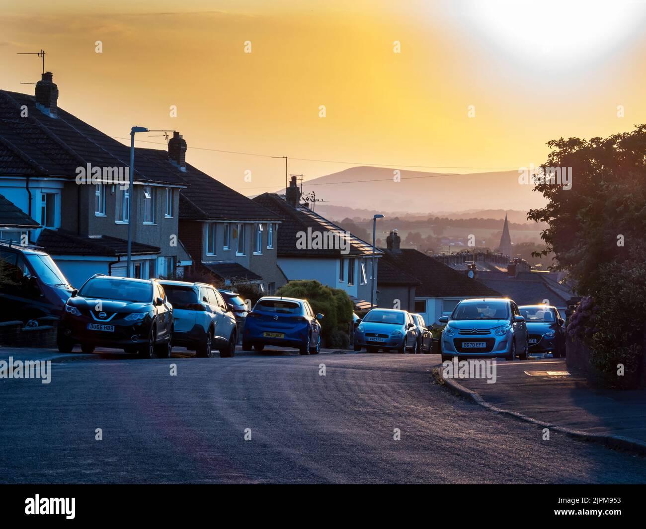 Sunset over Clitheroe looking towards the Bowland Fells, Lancashire, UK ...