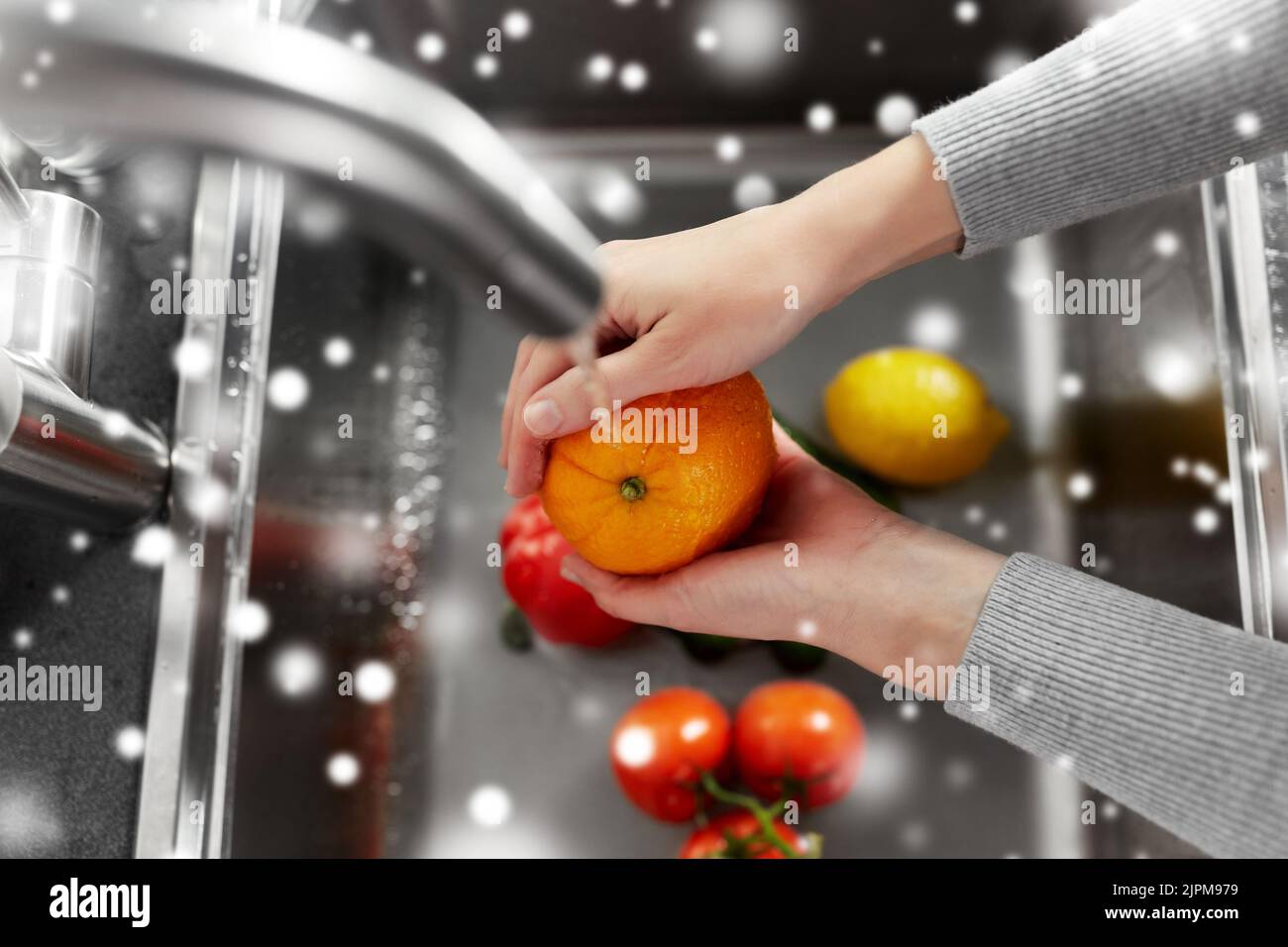woman washing fruits and vegetables in kitchen Stock Photo - Alamy