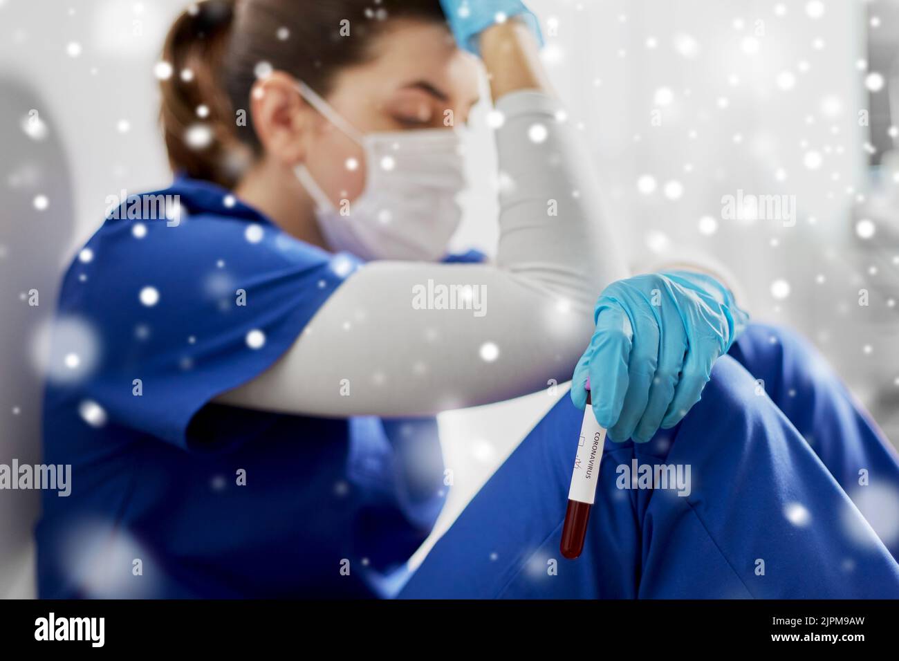 sad doctor or nurse holding beaker with blood test Stock Photo - Alamy