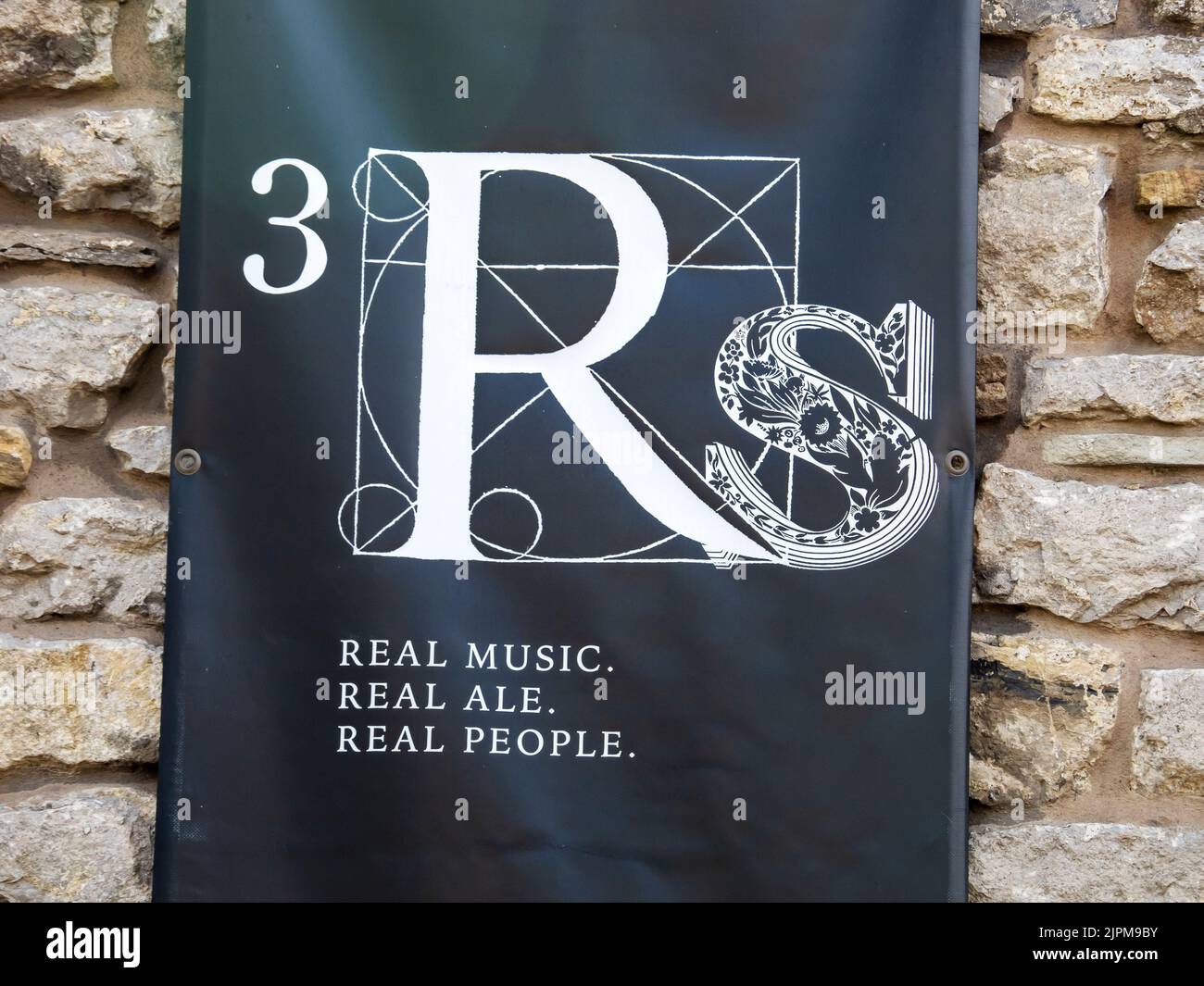 A banner on a pub in Clitheroe, Lancashire, UK, advertising real people ...