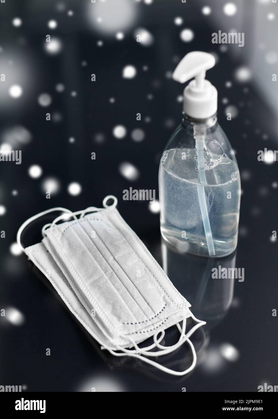 hand sanitizer or liquid soap and medical masks Stock Photo - Alamy