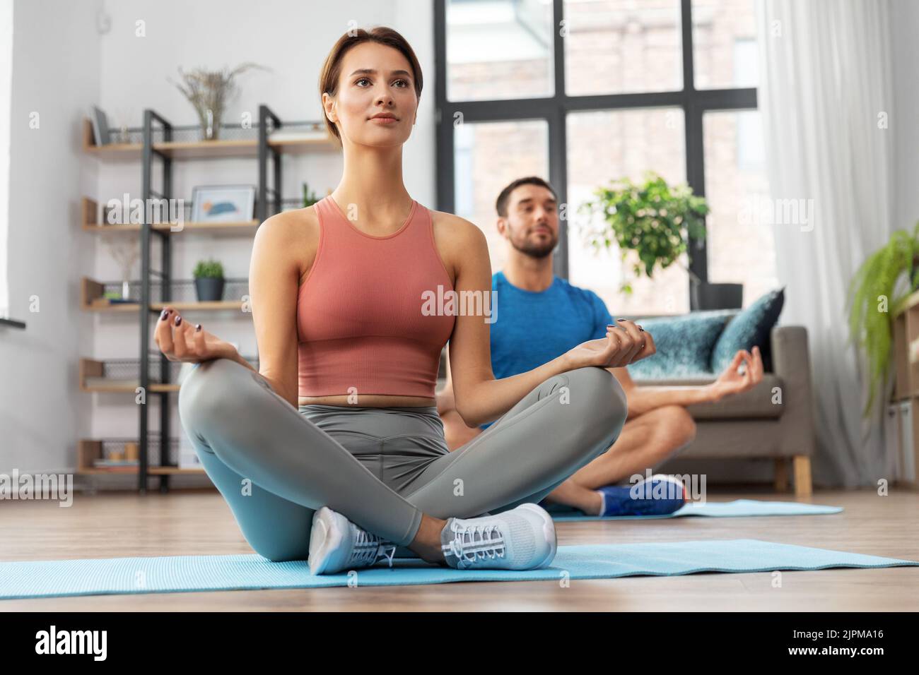 Couple in lotus position hi-res stock photography and images - Alamy