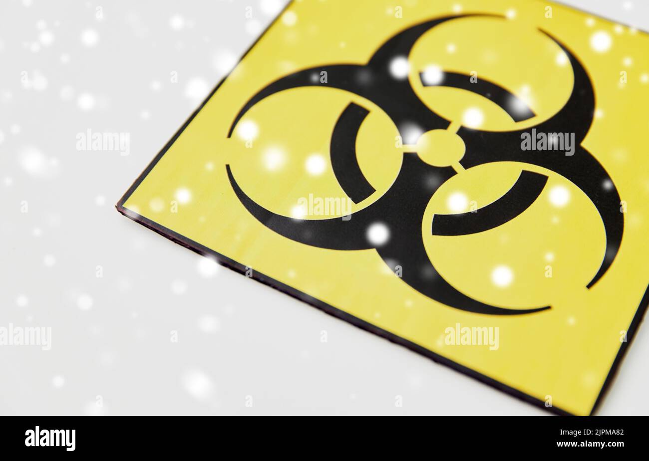 biohazard caution sign on white background Stock Photo - Alamy