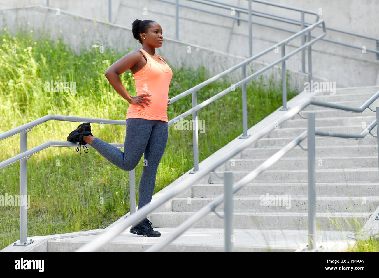 young african american woman stretching outdoors Stock Photo - Alamy