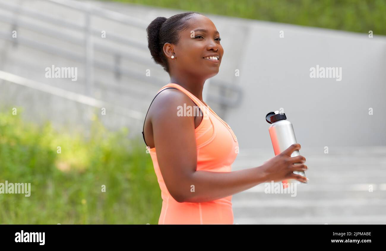 african american woman drinking water from bottle Stock Photo - Alamy