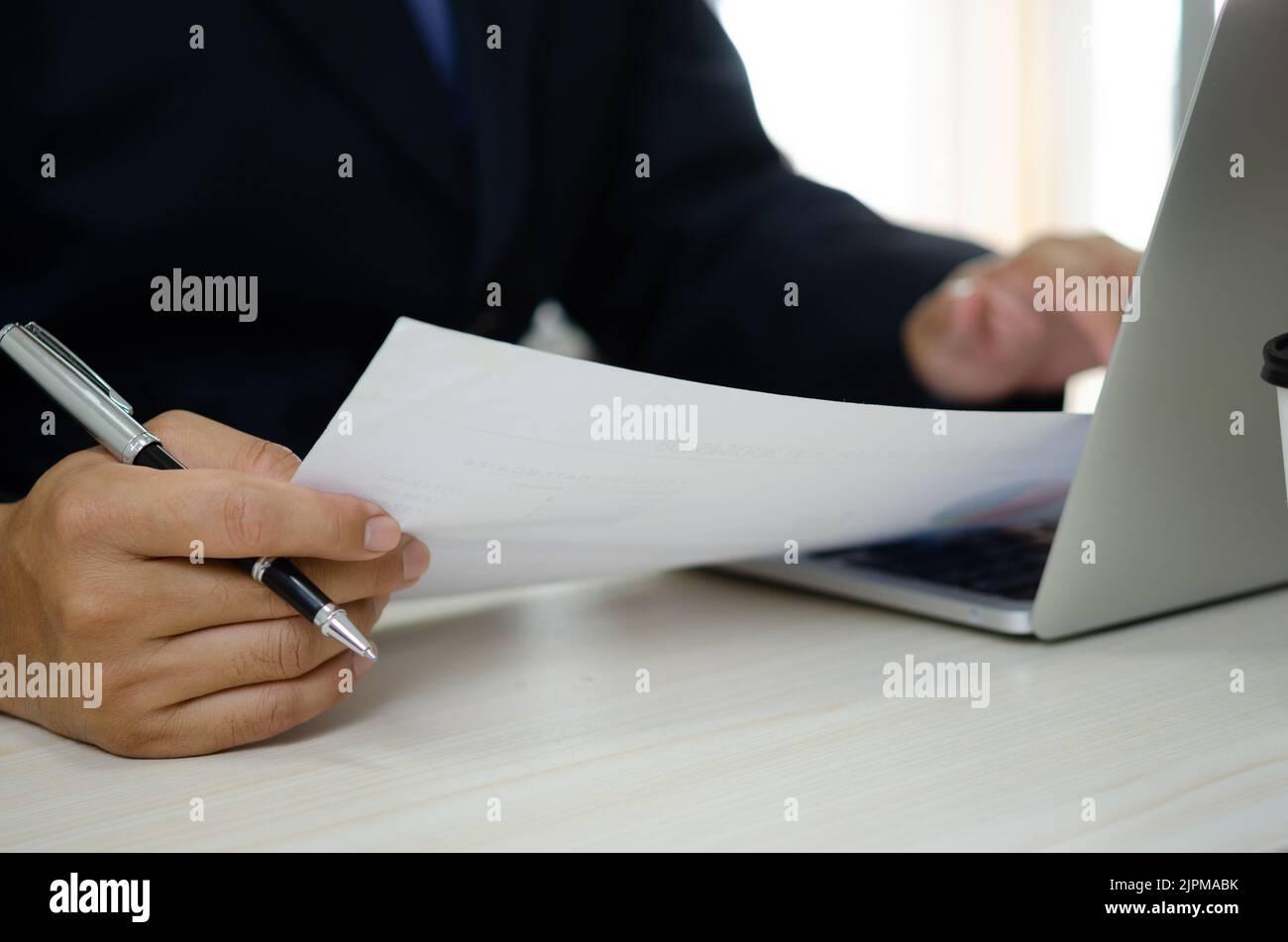 Businessman holding documents charts hi-res stock photography and ...