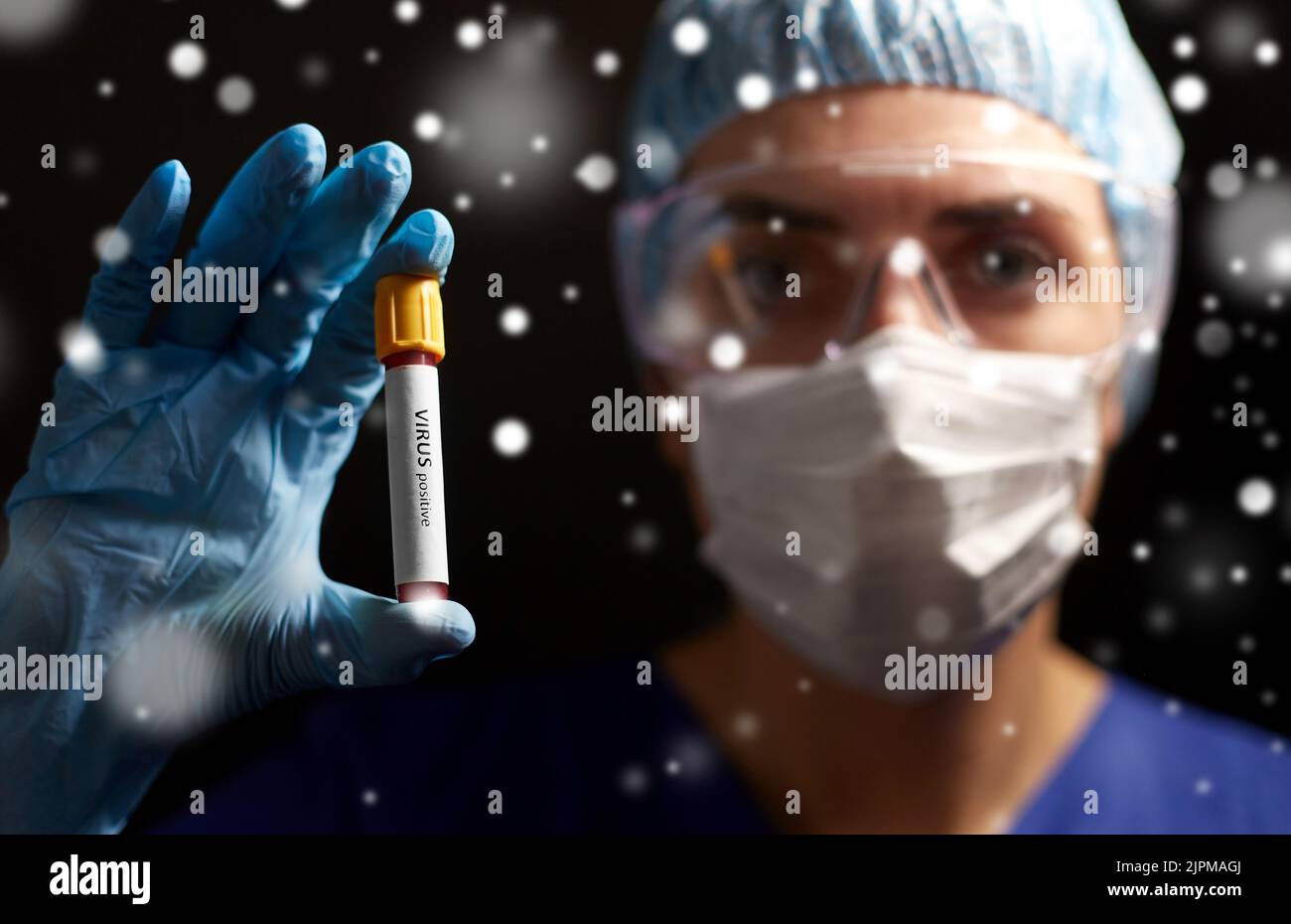Doctor holding beaker coronavirus blood hi-res stock photography and ...