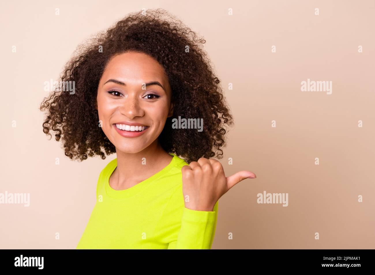 Closeup photo of young smiling toothy lady directing empty space cool ...