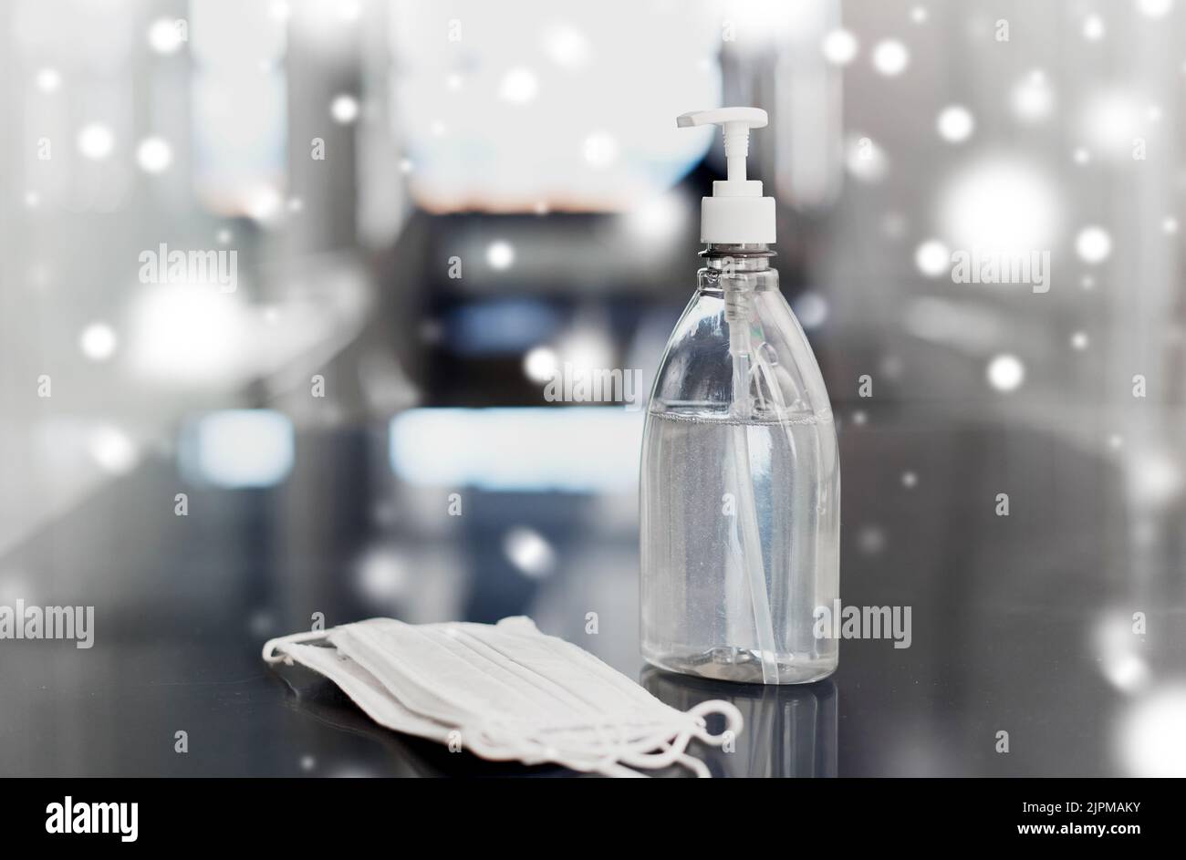 hand sanitizer or liquid soap and medical masks Stock Photo - Alamy