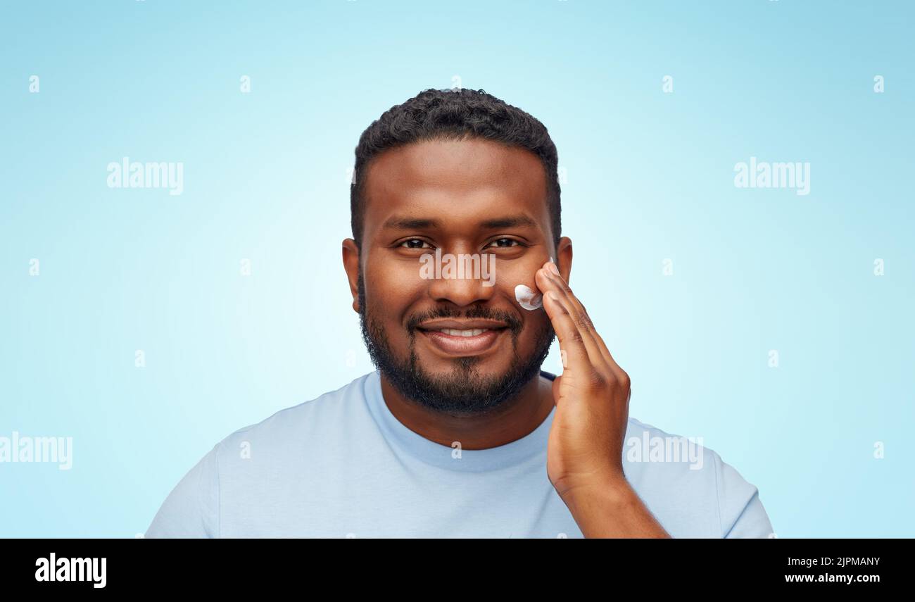 Handsome black man applying face hi-res stock photography and images - Alamy