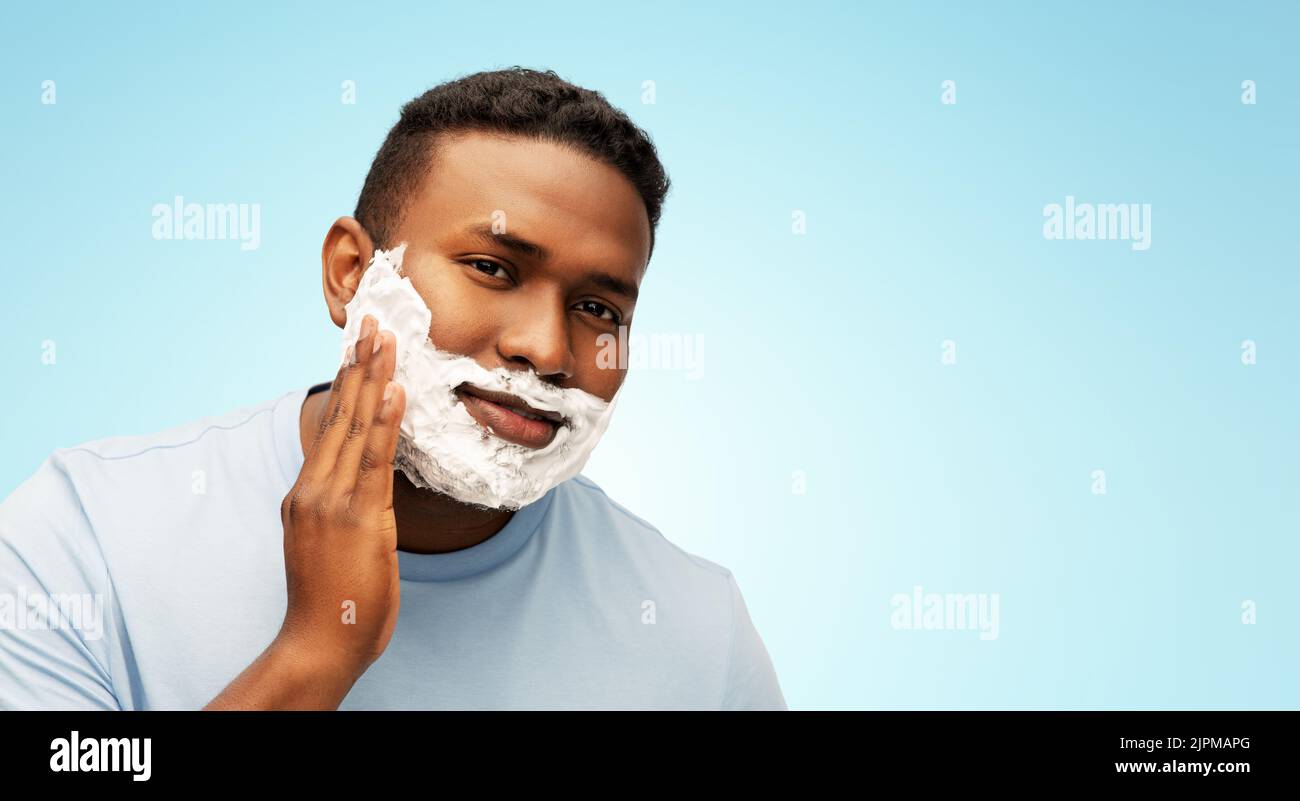 african american man applying shaving foam to face Stock Photo - Alamy