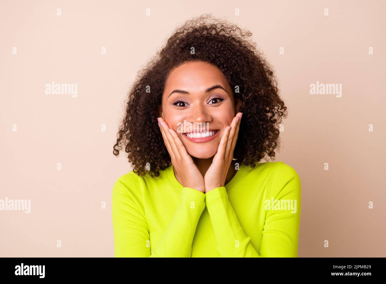 Closeup photo of young pretty lady hold cheeks hands smiling toothy ...