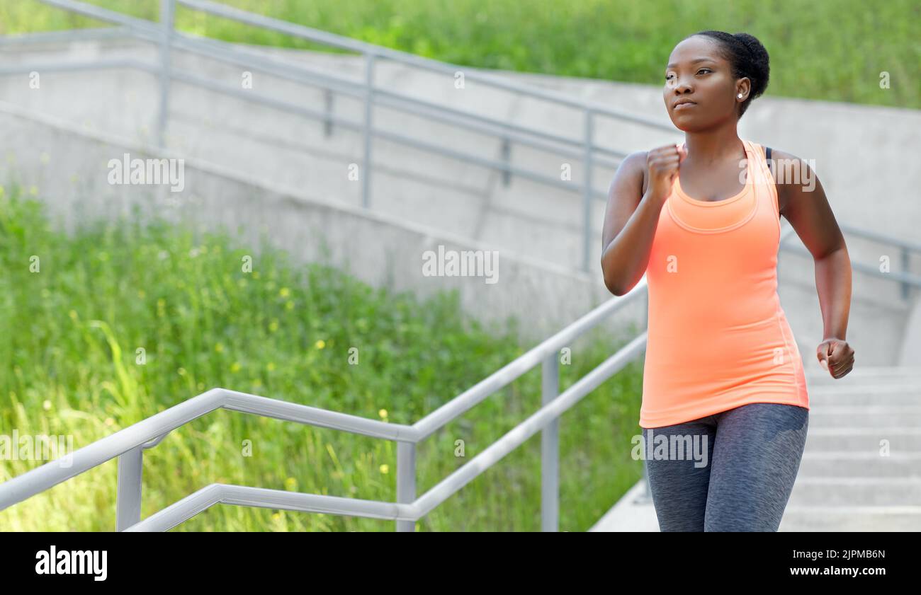 African american woman running downstairs hi-res stock photography and ...