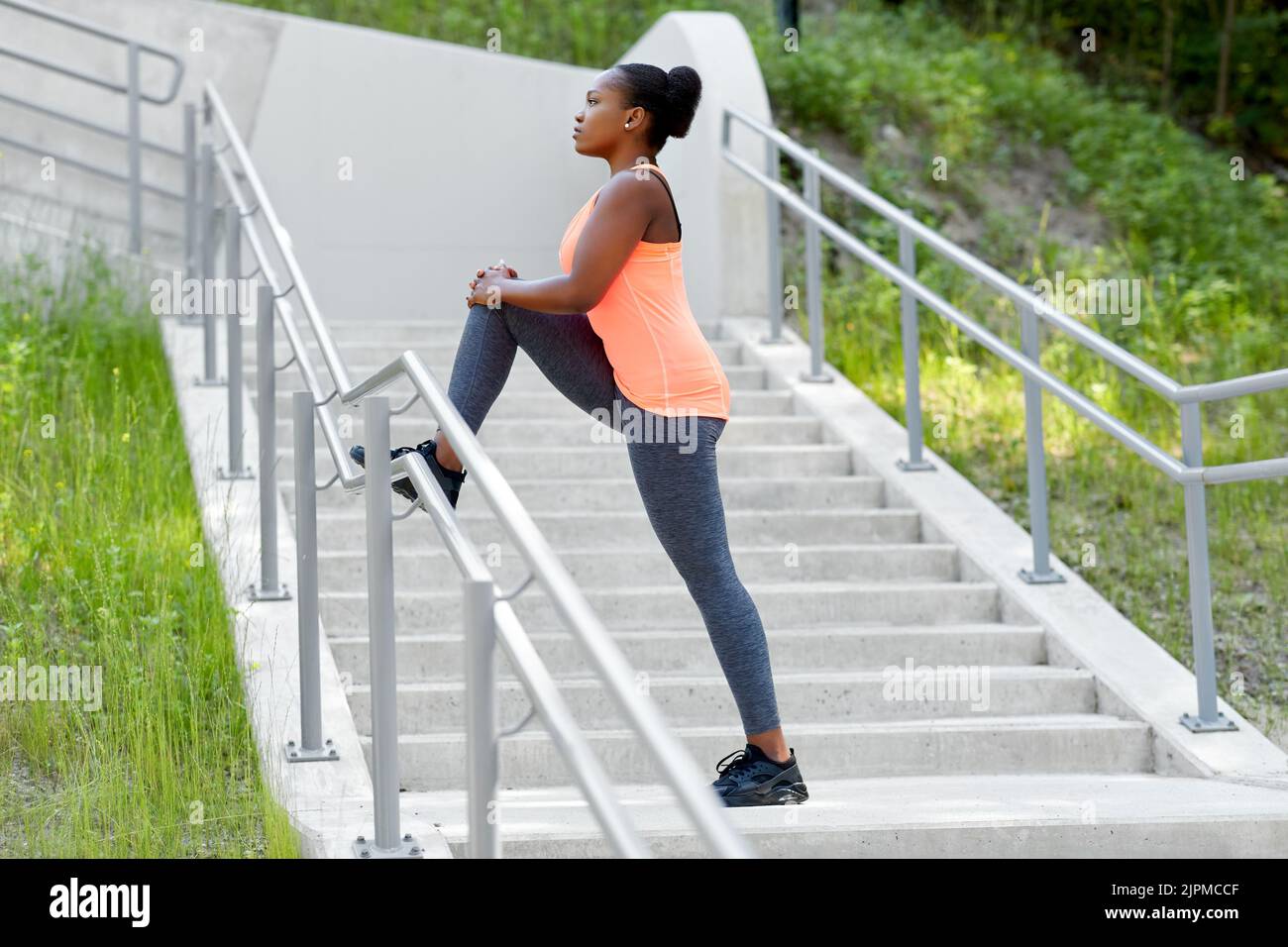 young african american woman stretching outdoors Stock Photo - Alamy
