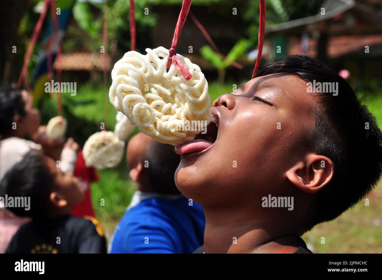 West Java, Indonesia - August 17, 2022: Little child are following the ...