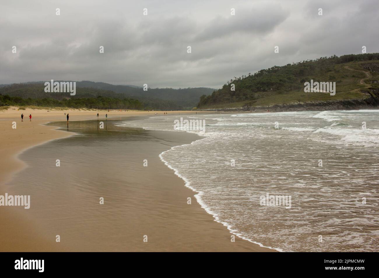 little waves drawing lines in the sand when they reach the coast Stock ...