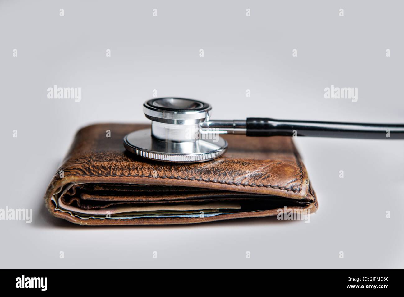 expensive medicine concept. stethoscope and wallet as symbol of ...